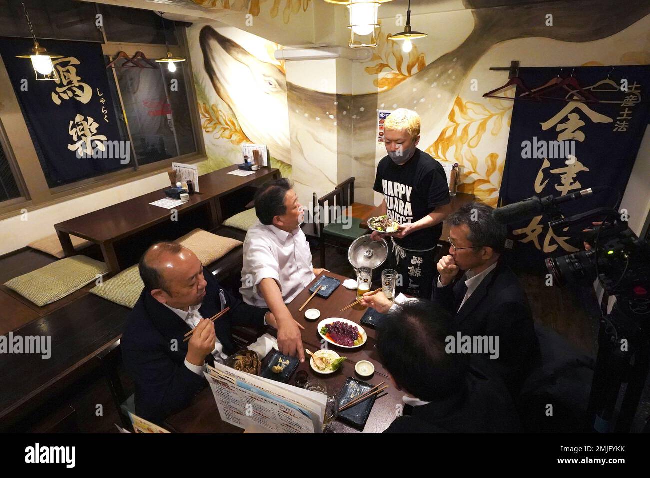Customers try whale meat at the Japanese restaurant "Kujira no Ibukuro ...