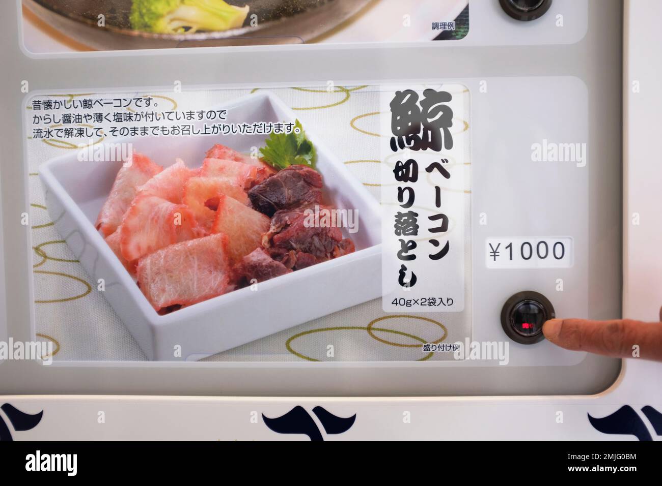 Konomu Kubo, a spokesperson for Kyodo Senpaku Co. points to the button ...