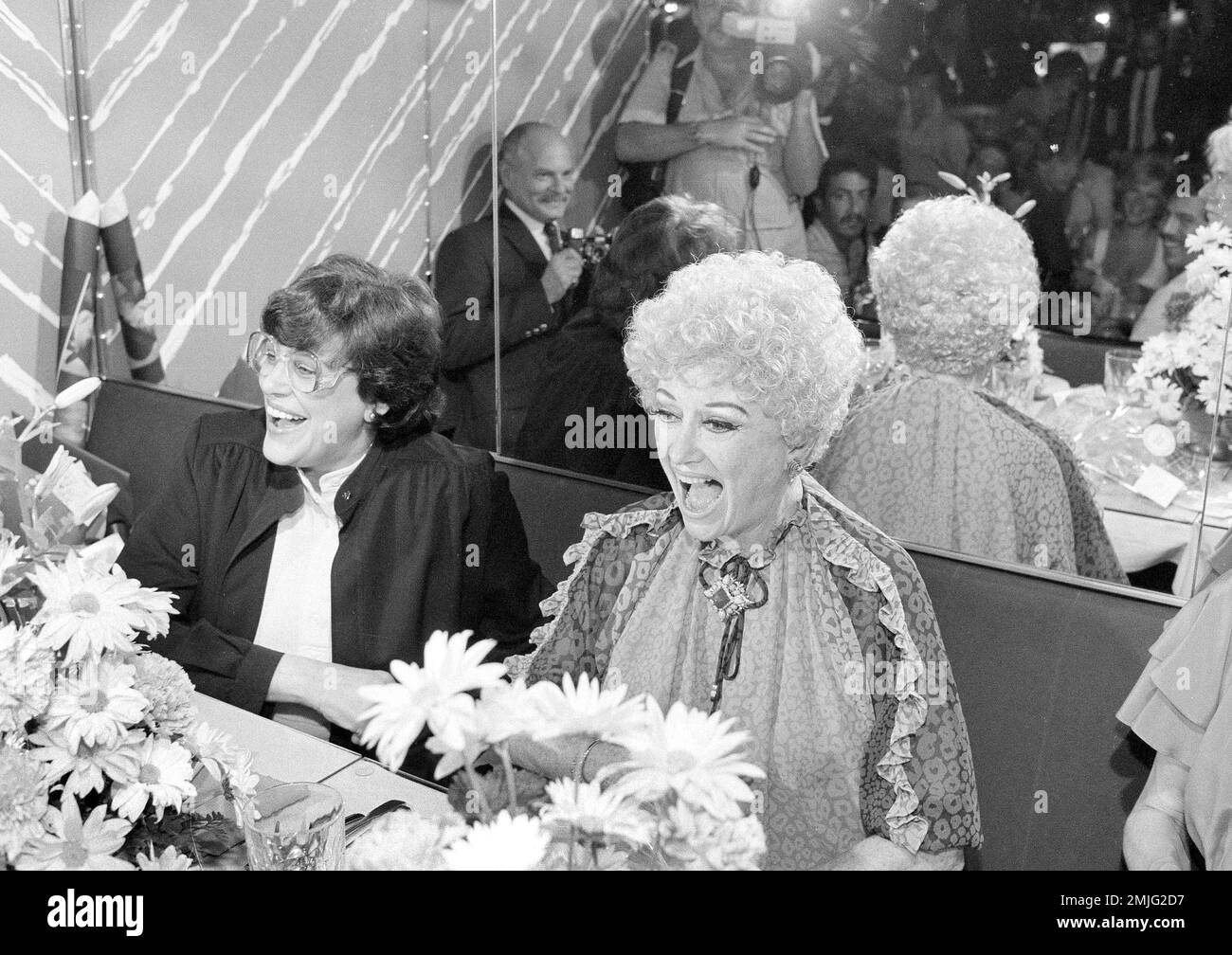 Kaye Ballard helps Phyllis Diller celebrate her 65th birthday during a ...