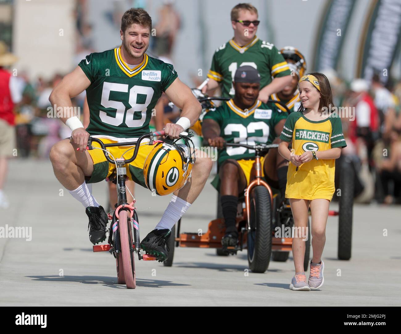Green Bay Packers' Brady Sheldon rides a bike to NFL football training ...
