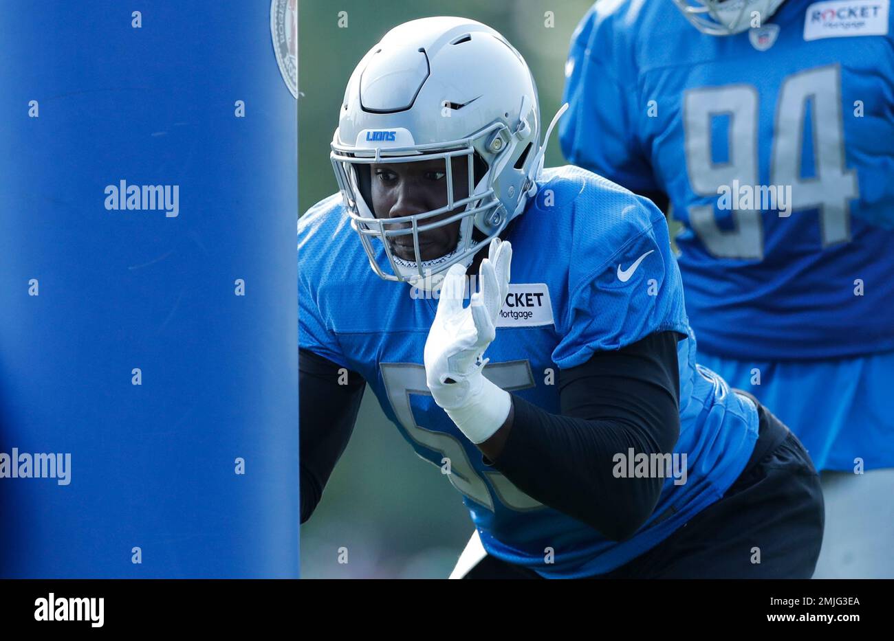 Detroit Lions defensive end Eric Lee hits a tackling dummy during a ...