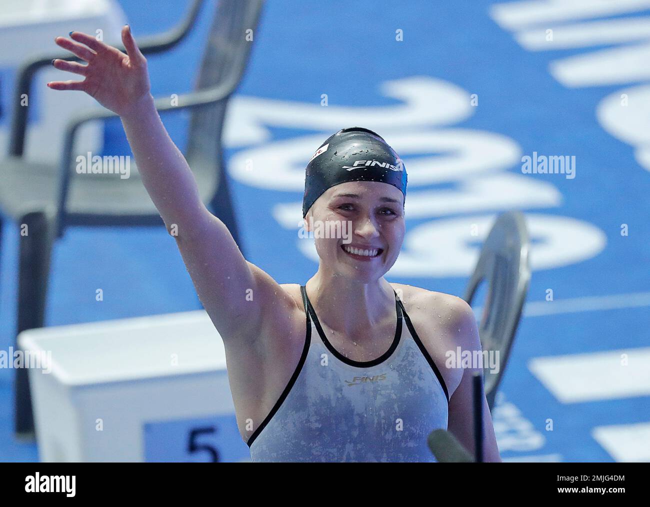 United States' Olivia Smoliga waves after winning the women's 50m ...