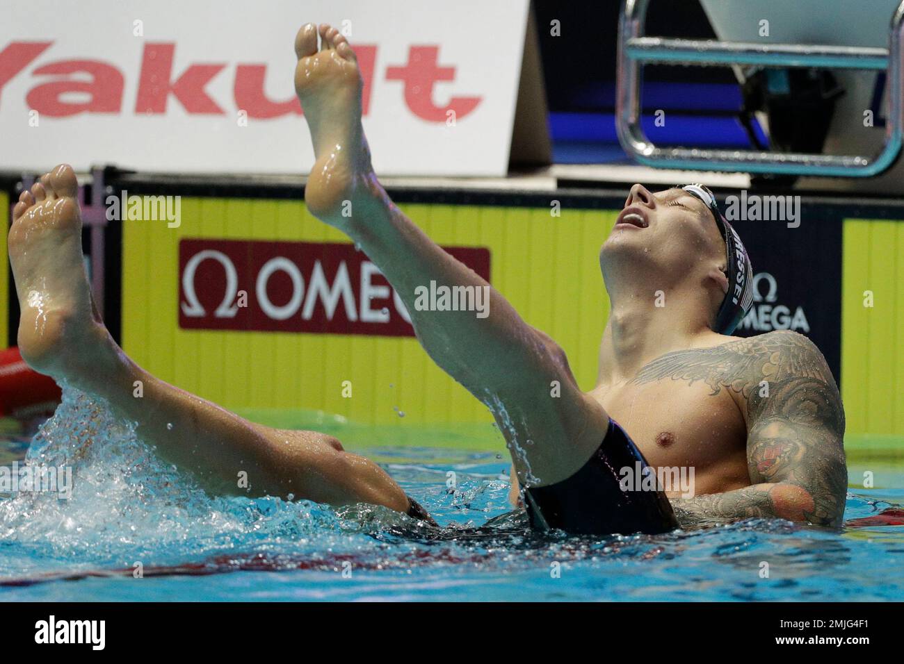 United States' Caeleb Dressel celebrates after winning the men's 100m ...