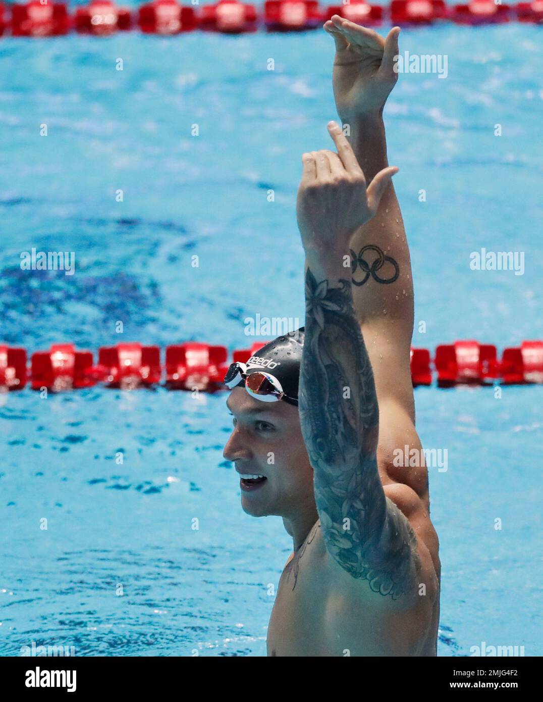 United States' Caeleb Dressel celebrates after winning the men's 100m ...