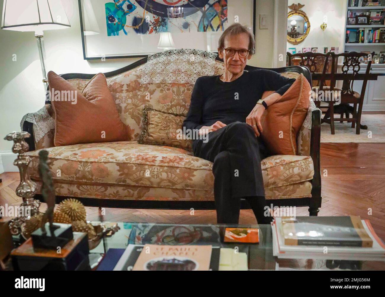 In this July 23, 2019, photo, poet and author J. Chester Johnson sits ...