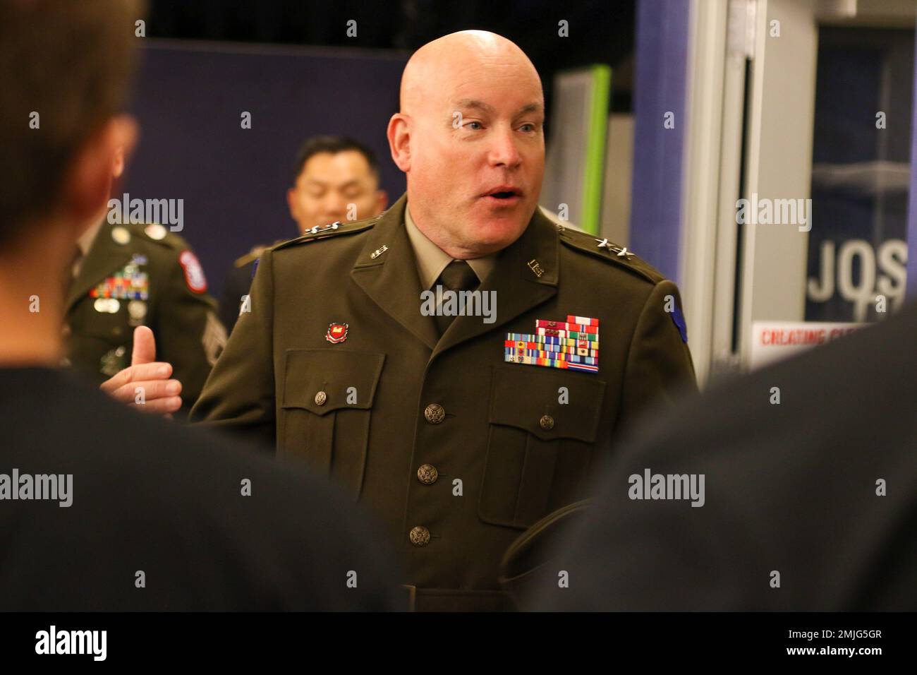 Major Gen. Matthew Baker, center, commanding general, 88th Readiness Division, speaks to more ...