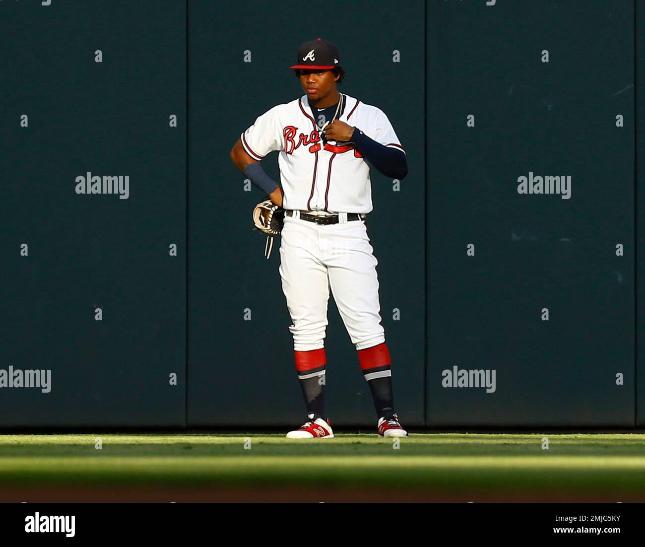 Atlanta Braves left fielder Ronald Acuna, Jr. (13) stands in the sun in ...