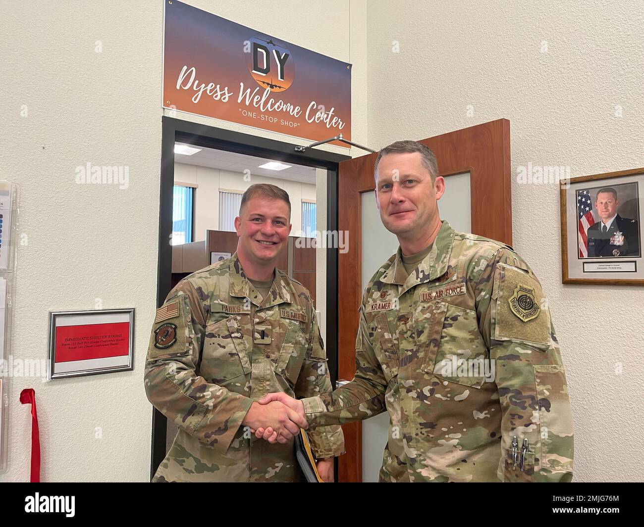 Col. Joseph Kramer, 7th Bomb Wing commander, right, shakes the hand of ...