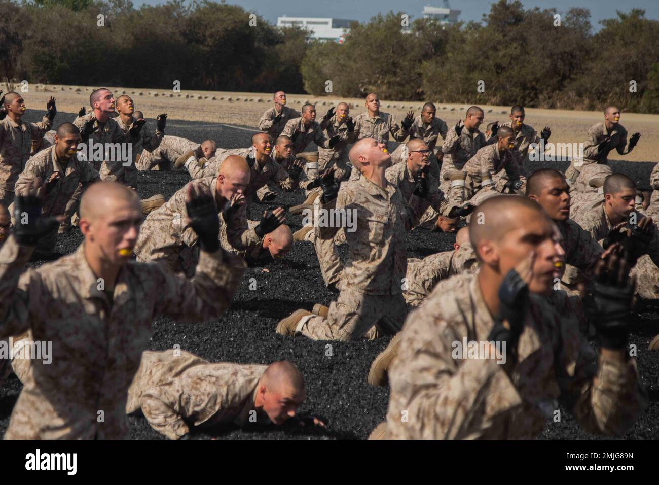 U.S. Marine Corps recruits with Hotel Company, 2nd Recruit Training Battalion, execute a forward ...