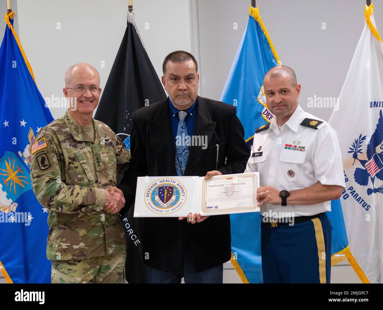 LTG Ronald J. Place, DHA Director, and SGM Isaac A. Bray, present the ...