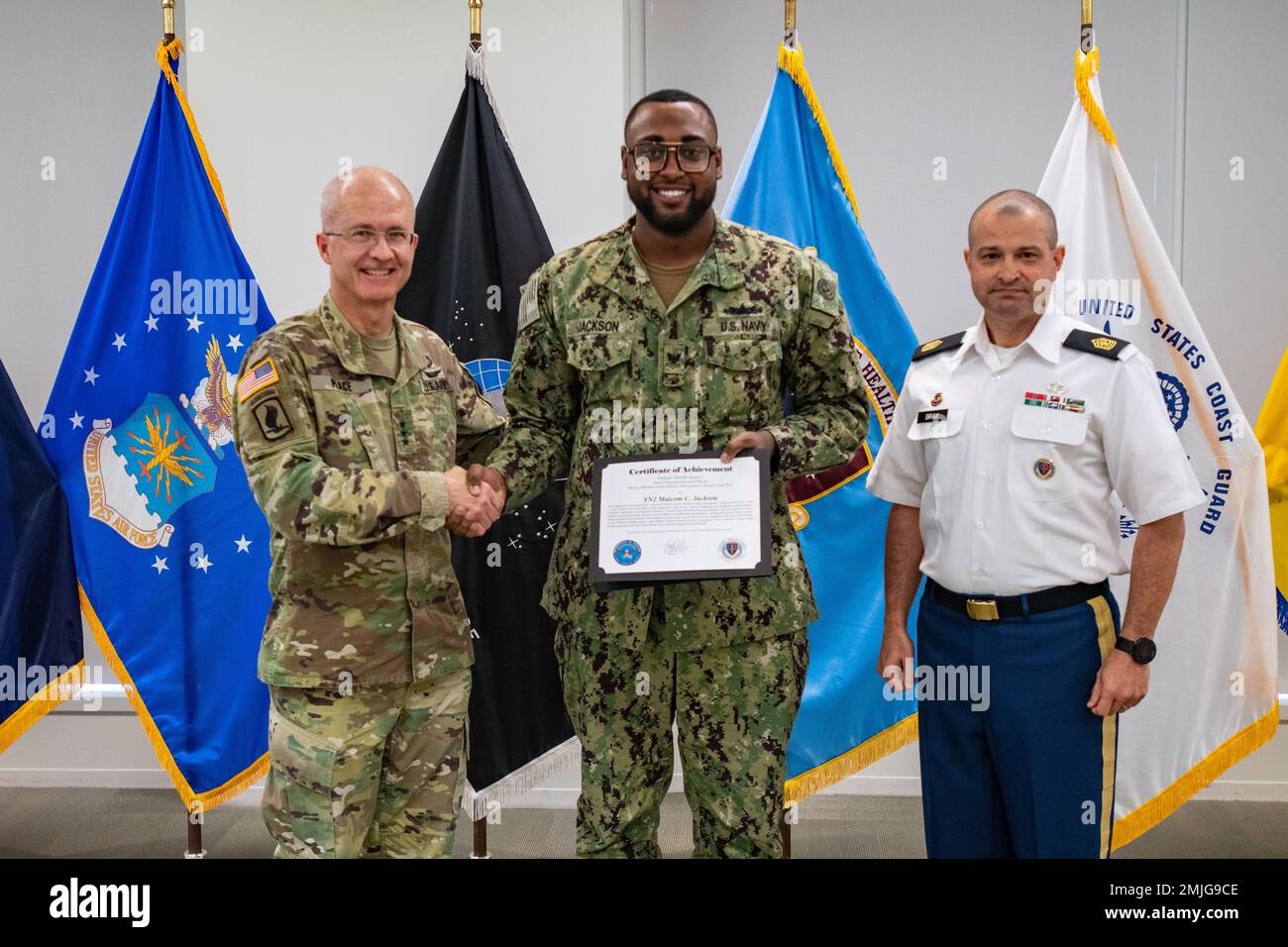 LTG Ronald J. Place, DHA Director, and SGM Isaac A. Bray, present the ...