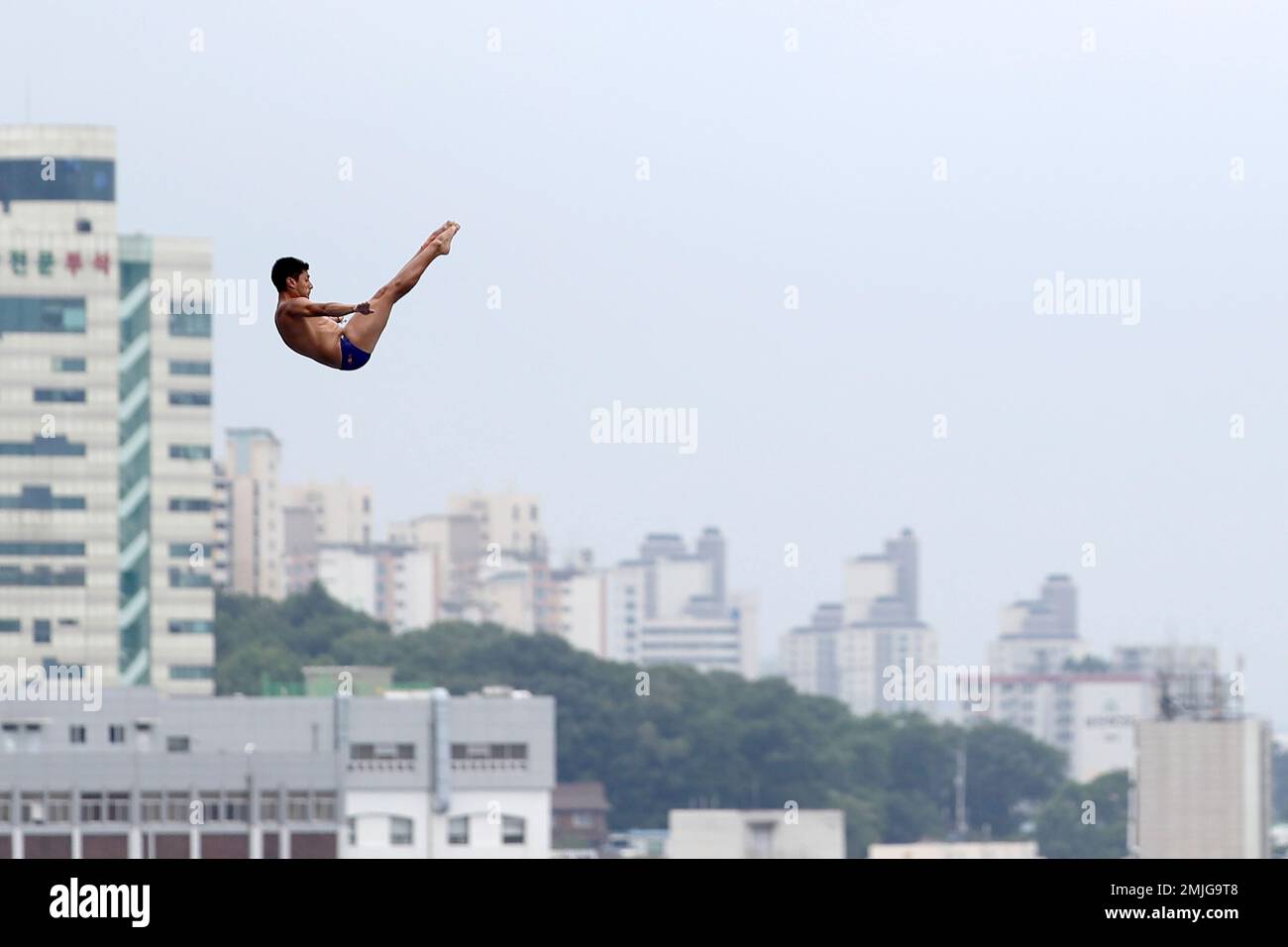 Jonathan Paredes of Mexico dives during the men's high diving ...