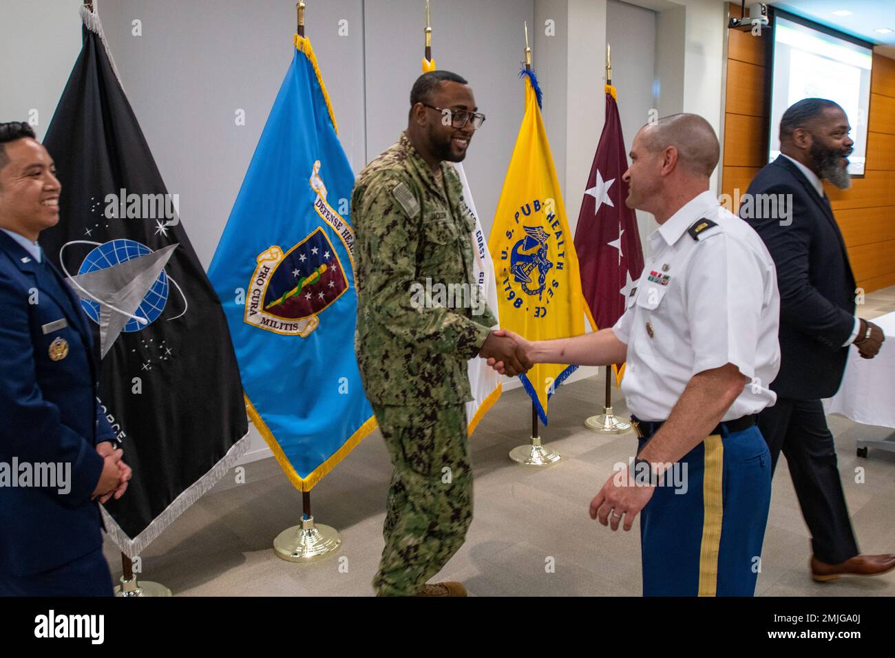 SGM Isaac A. Bray, Senior Enlisted Leader, DHA J1, congratulates, YN2 ...