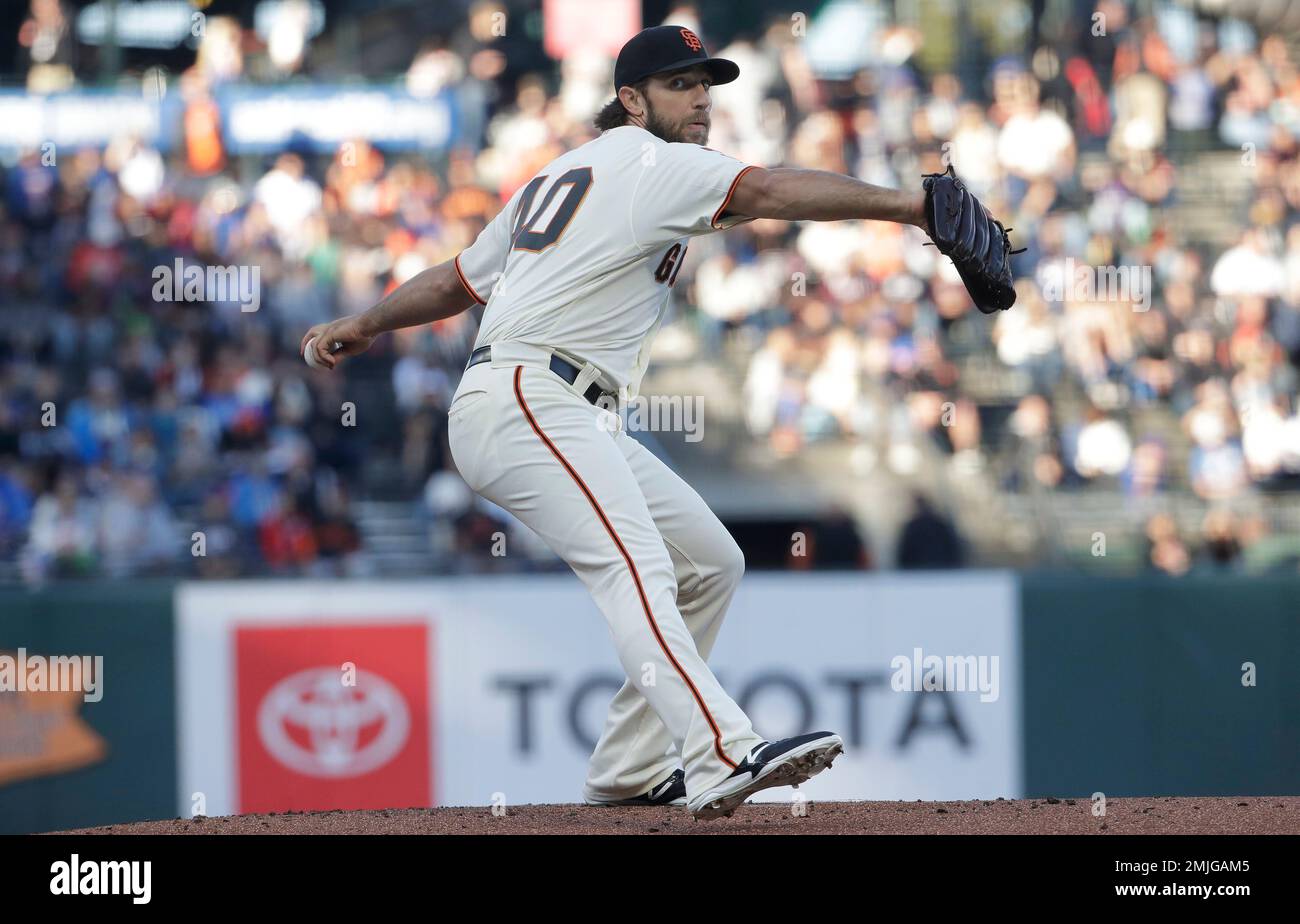 San Francisco Giants pitcher Madison Bumgarner throws to a Chicago Cubs ...