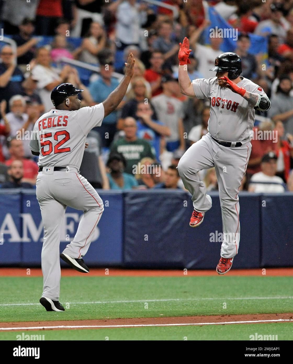 Boston Red Sox third base coach Carlos Febles, left, congratulates ...