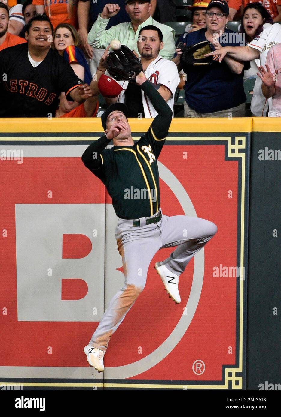 Oakland Athletics right fielder Mark Canha catches the fly ball of ...