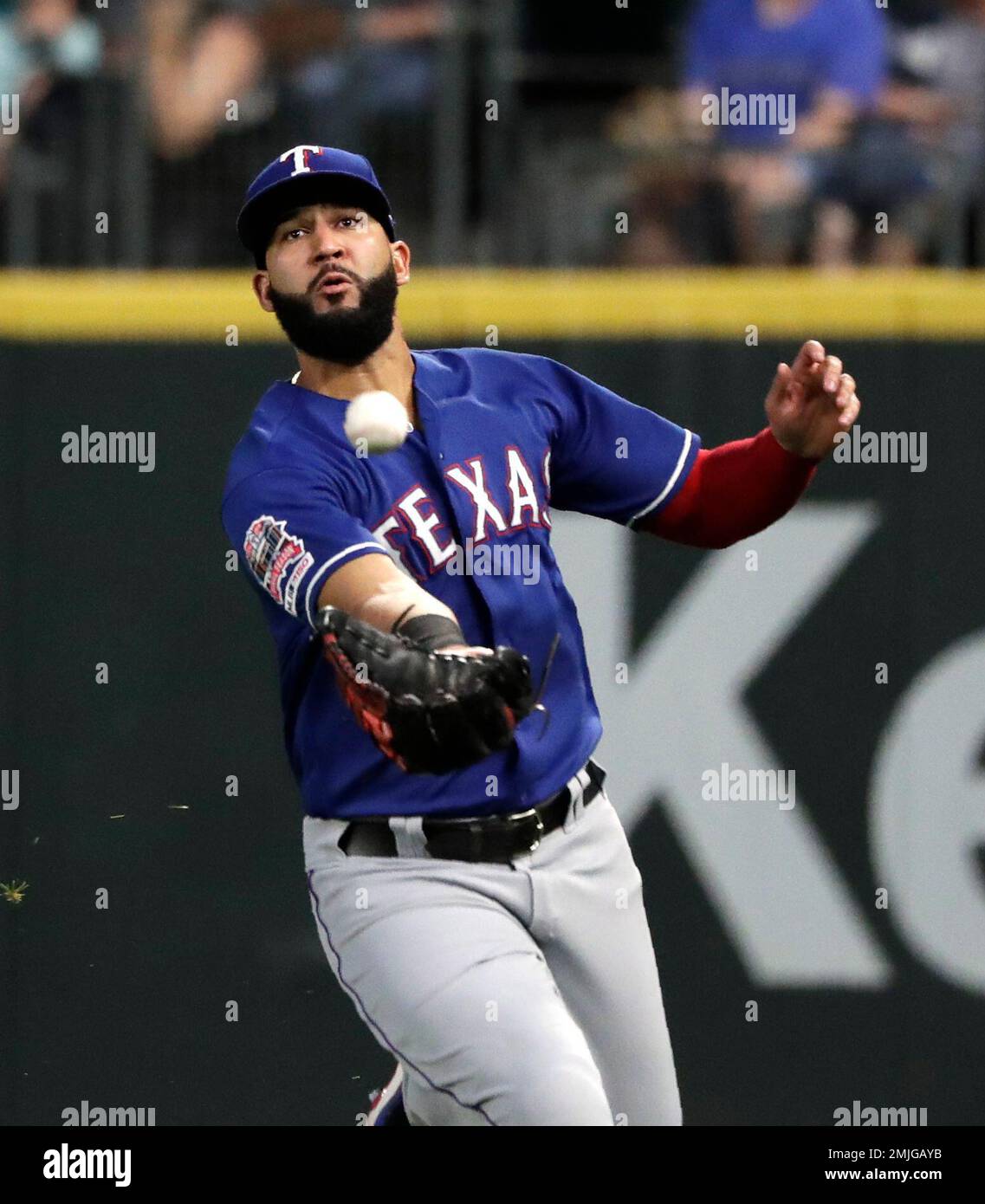 Texas Rangers right fielder Nomar Mazara reaches for a fly ball from ...