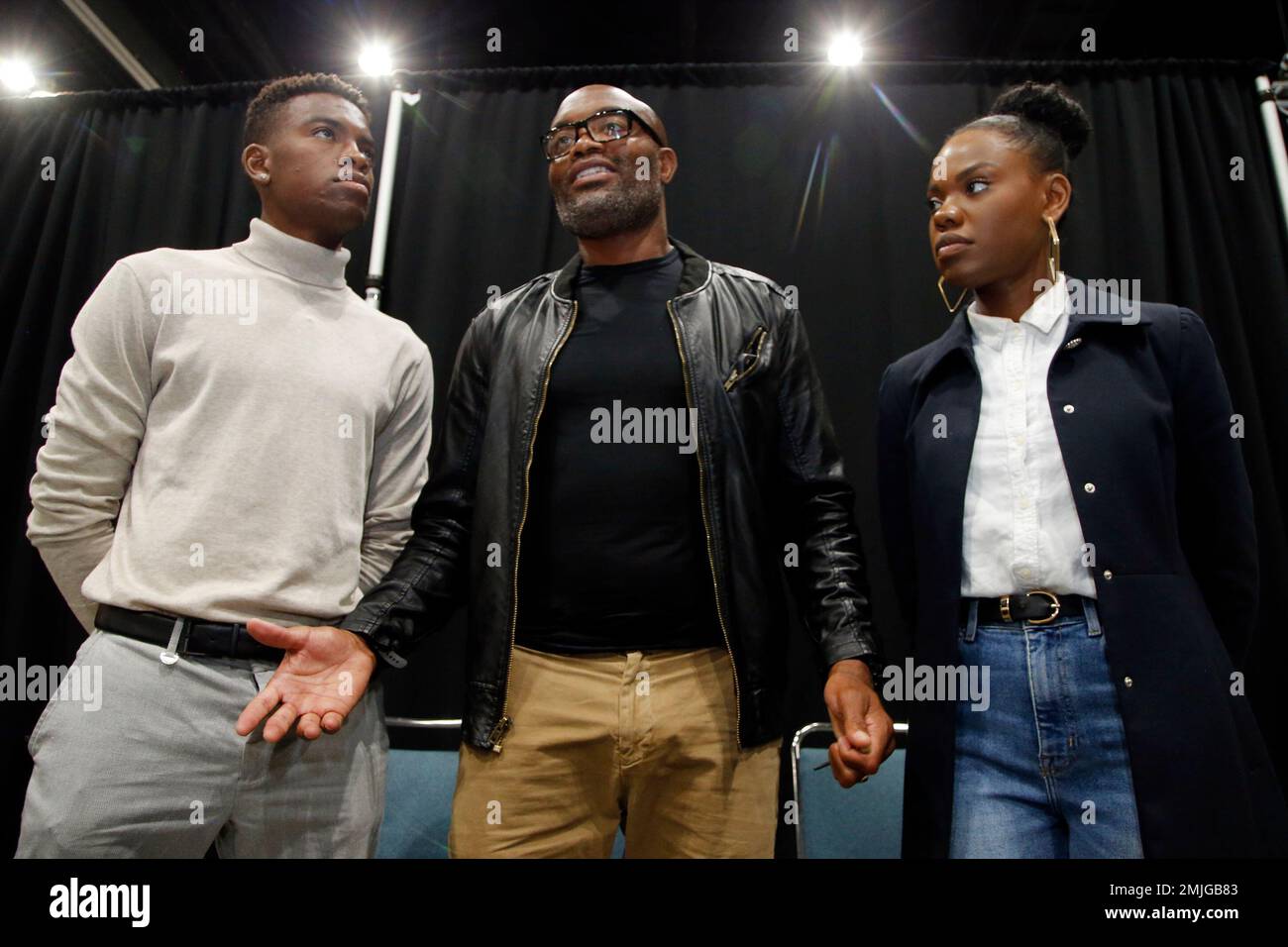 Mixed martial arts great Anderson Spider Silva of Brazil daughter Kaory 23 right and son Kalyl 20 left talk to reporters after all were sworn in as U.S. citizens in a mass