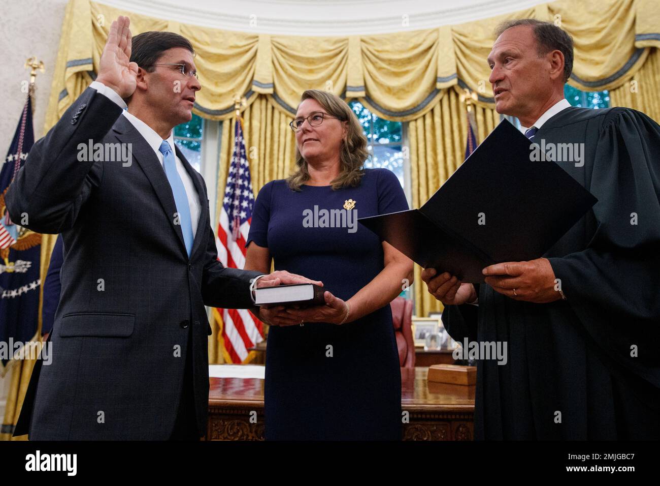 Mark Esper, left, is sworn in as the Secretary of Defense by Supreme ...