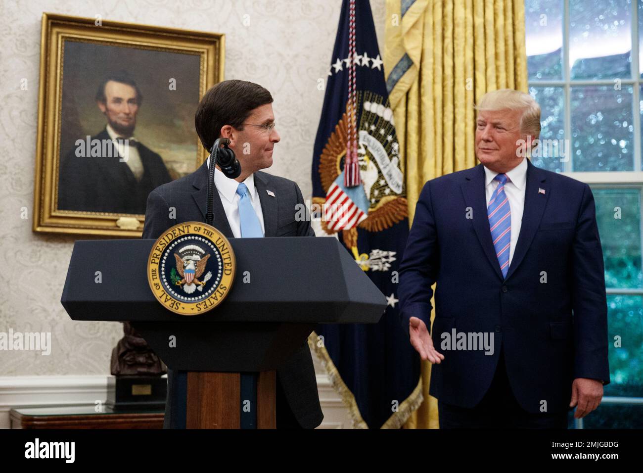 Secretary of Defense Mark Esper stands with President Donald Trump ...