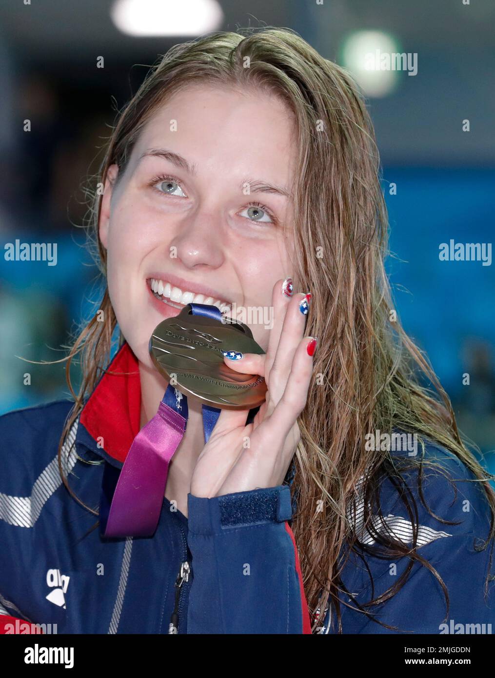 United States' Olivia Smoliga poses with her bronze medal following the ...