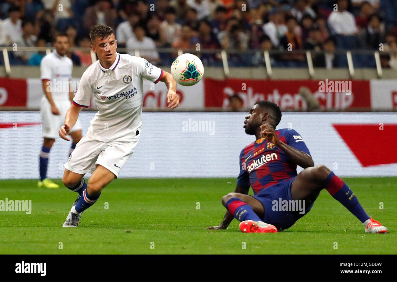 Chelsea's Mason Mount, left, and Barcelona's Samuel Umtiti vie for the ...