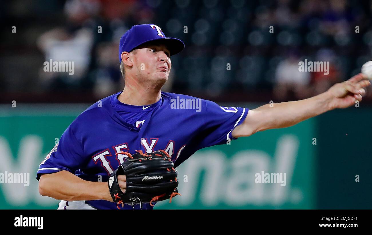 Texas Rangers relief pitcher Locke St. John throws to the Los Angeles ...