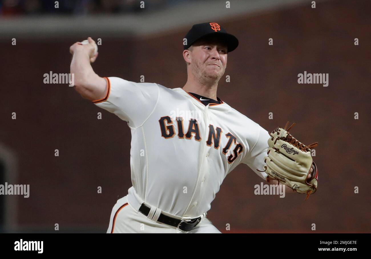 San Francisco Giants pitcher Trevor Gott throws to a Chicago Cubs batter during the eighth ...