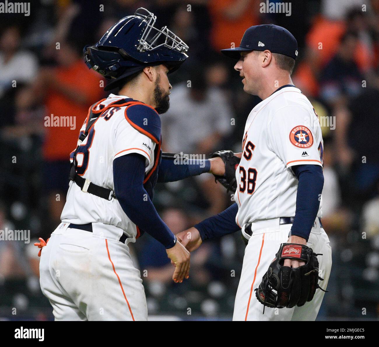 Houston Astros relief pitcher Joe Smith, right, and catcher Robinson ...
