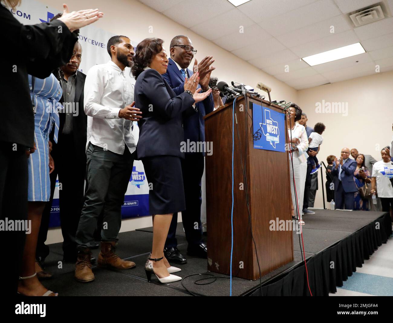 State Senator Royce West, center, and his wife Carol, center left ...