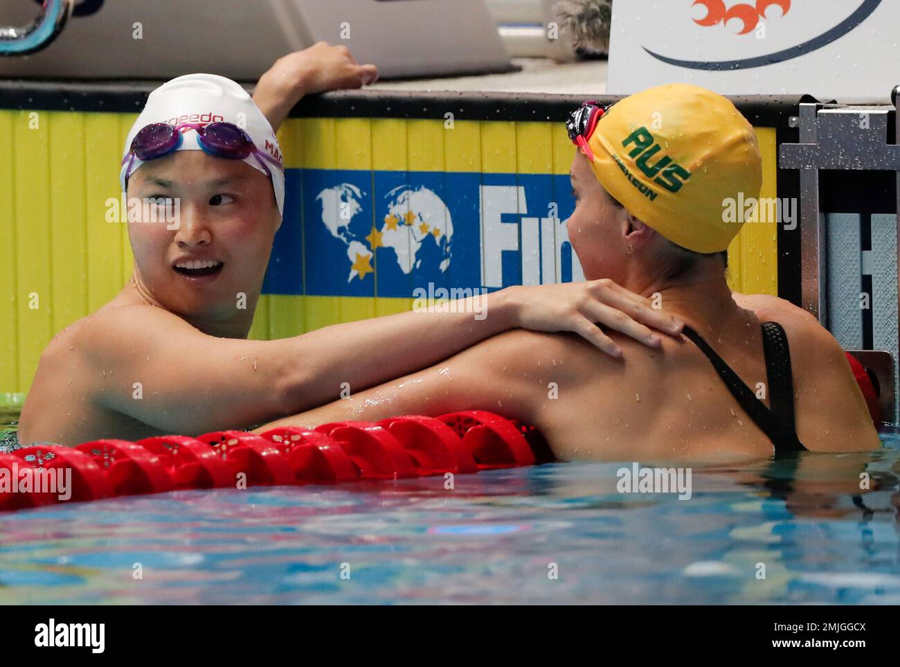 Canada's Margaret MacNeil, left, is congratulated by Australia's Emma ...