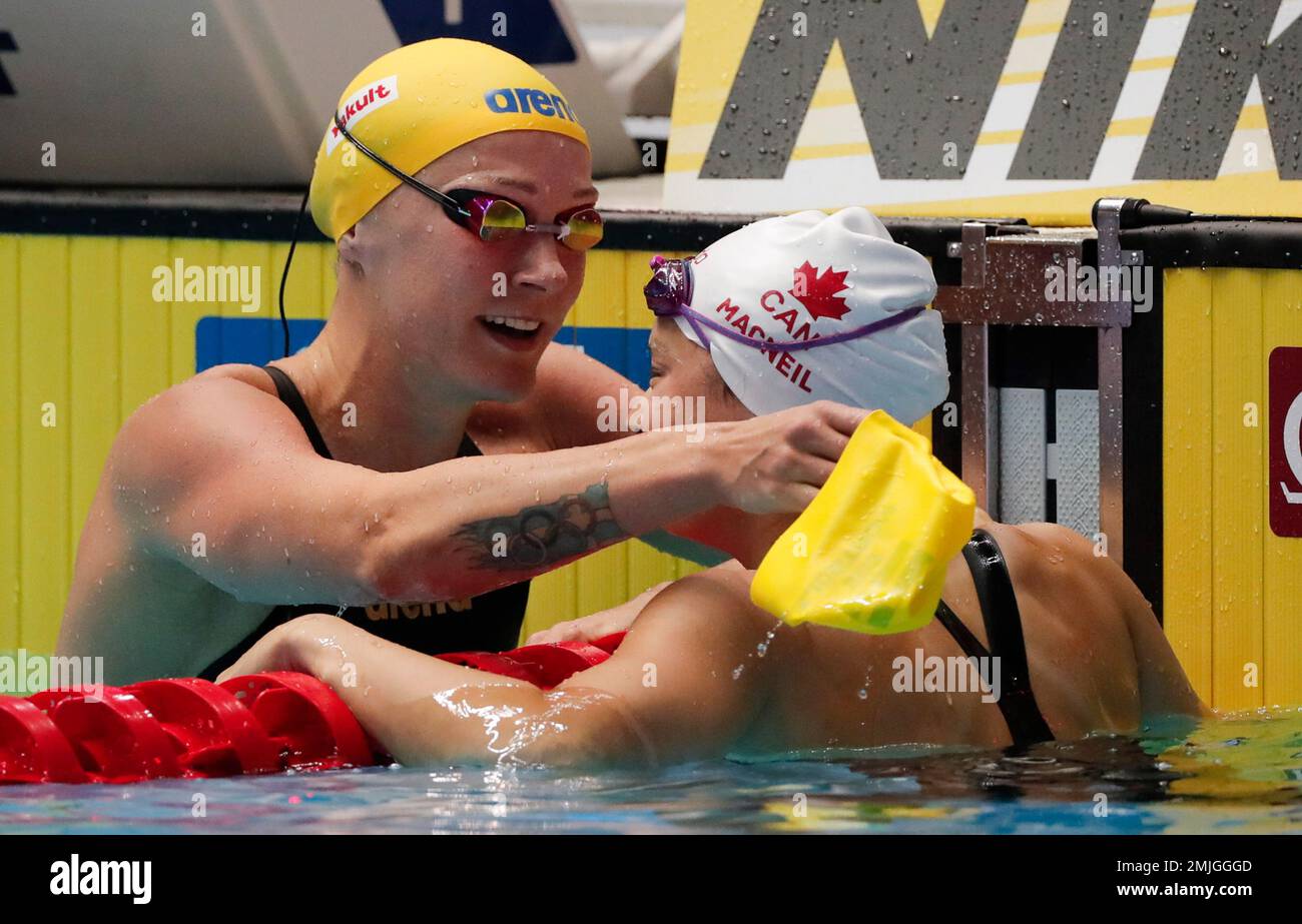 Canada's Margaret MacNeil, right, is embraced by Sweden's Sarah ...