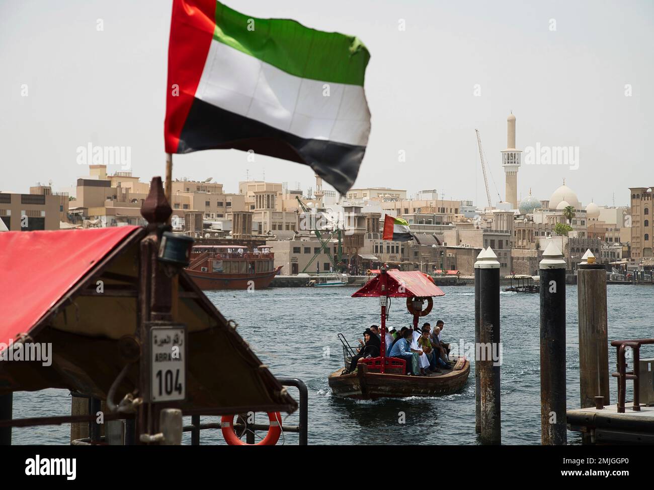 Passengers ride a traditional abra boat across the Dubai Creek in Dubai ...