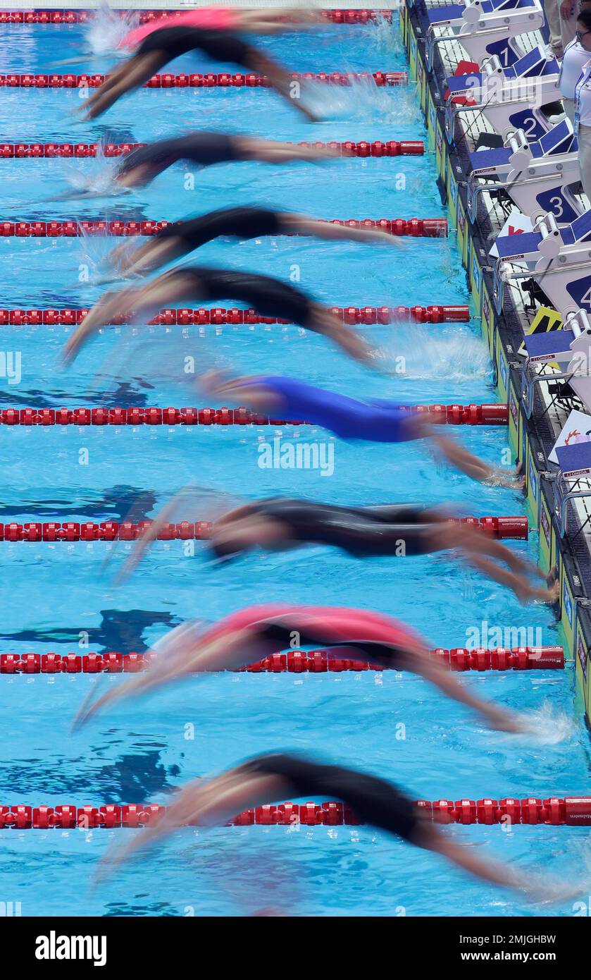 Swimmers start in their heat of the women's 100m backstroke at the ...