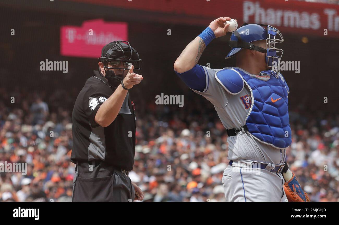 Home plate umpire Mark Ripperger, left, calls a strike on San Francisco ...
