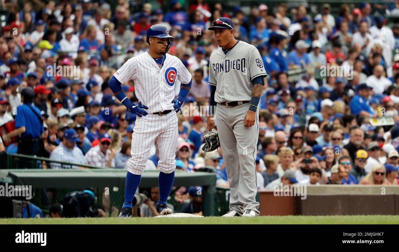 Chicago Cubs' Javier Baez, left, talks with San Diego Padres third ...
