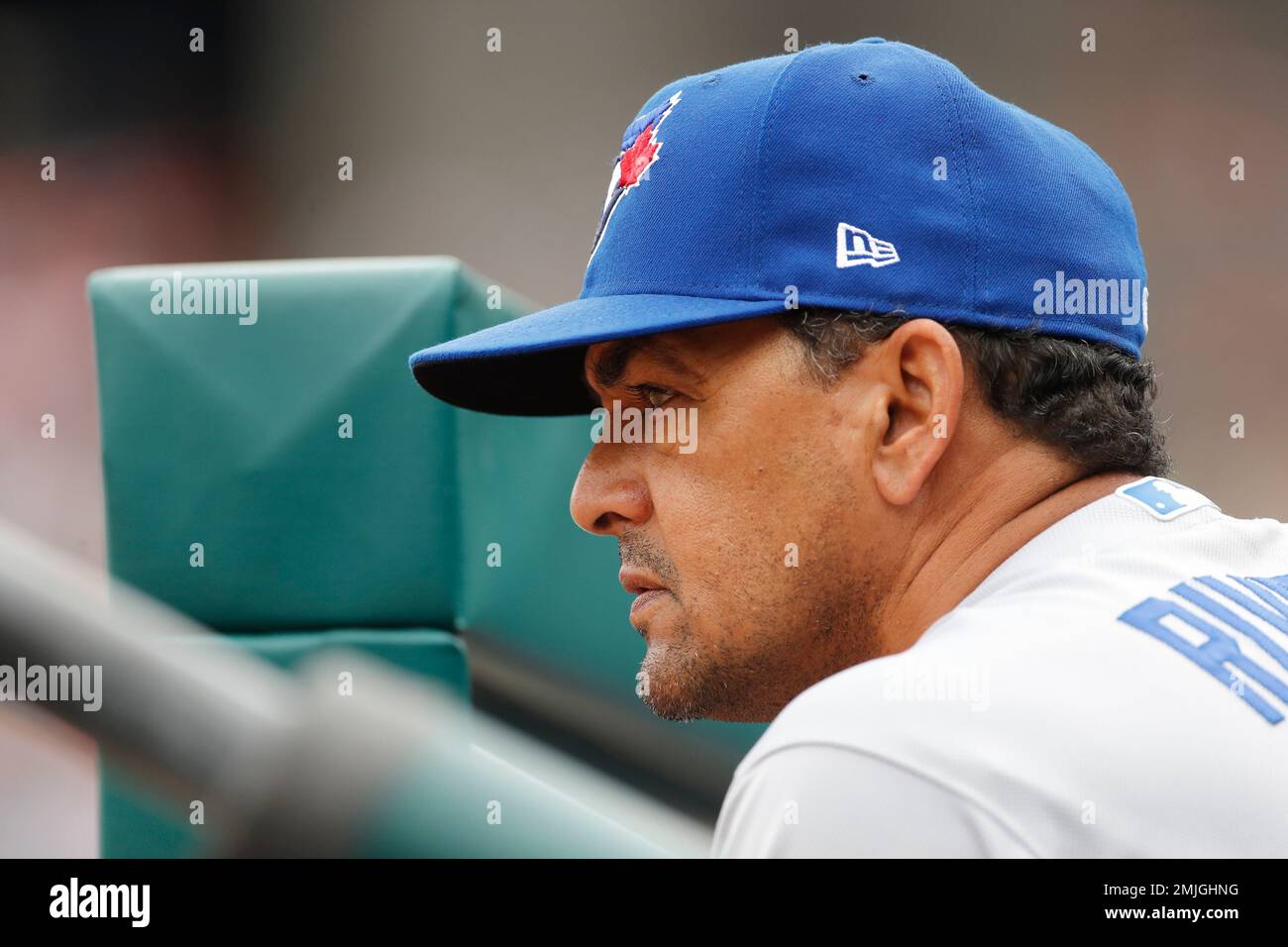 Toronto Blue Jays third base coach Luis Rivera watches from the dugout ...