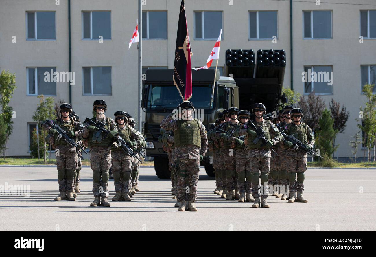 Members of the Georgian Defense Force 12th Infantry Battalion stand in ...