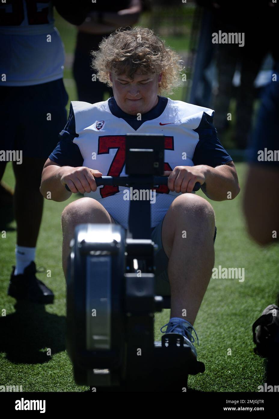 Josh Baker, a University of Arizona football player, pulls a row ...