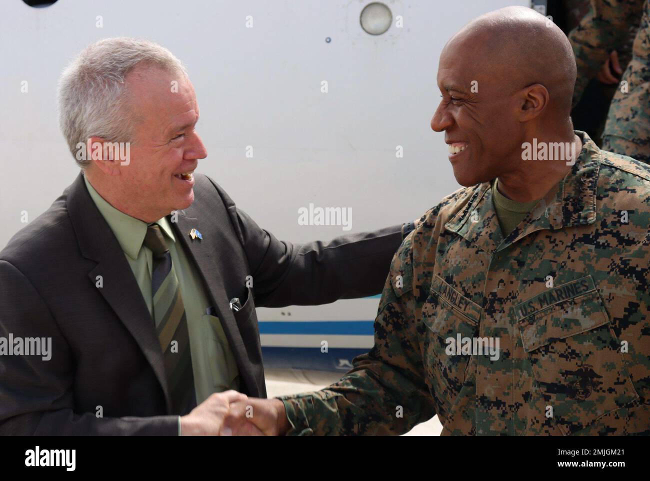 Amb. Larry André, U.S. Embassy in Somalia, greets U.S. Marine Corps Gen ...
