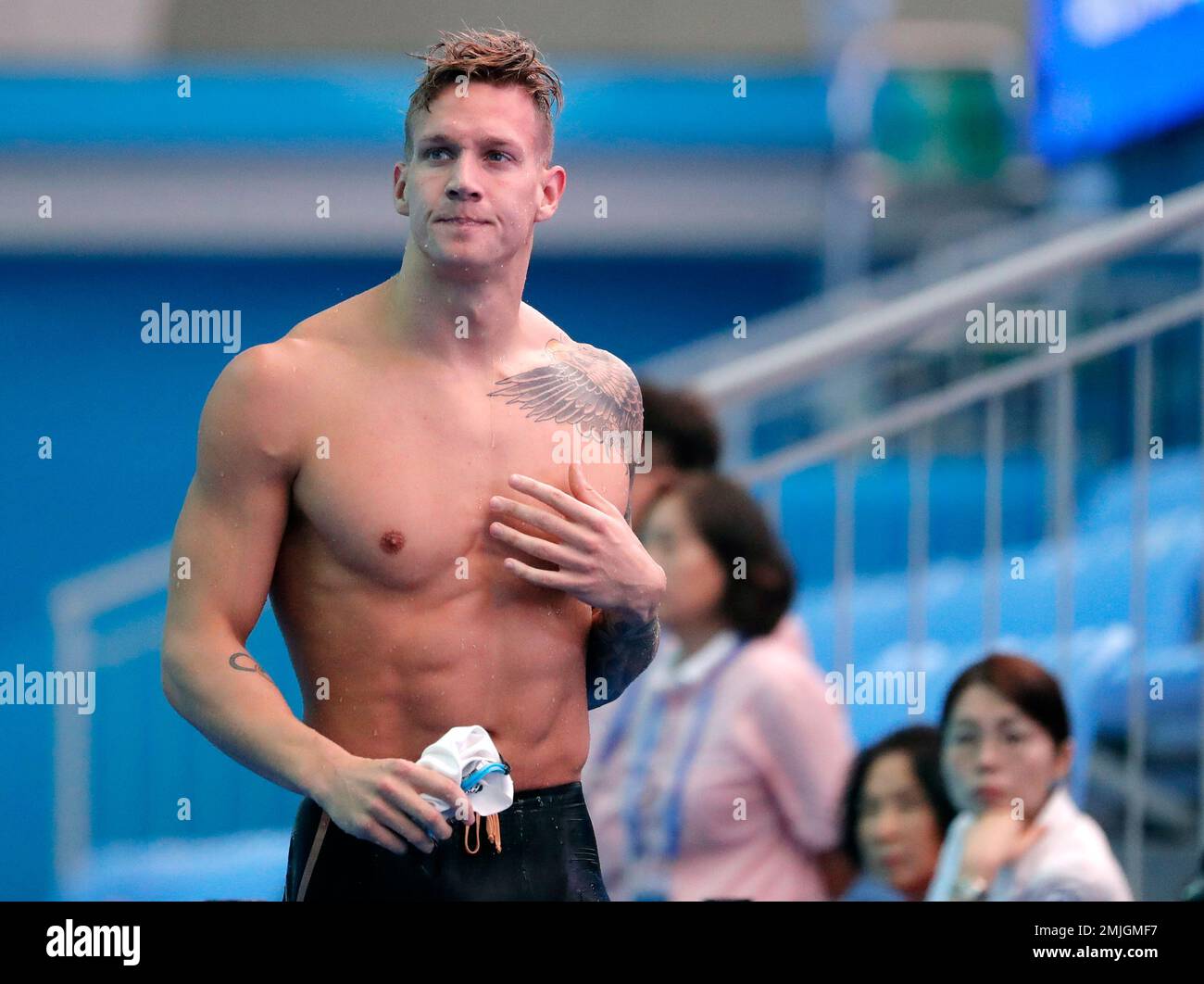 United States' swimmer Caleb Dressel reacts after his heat in the men's ...