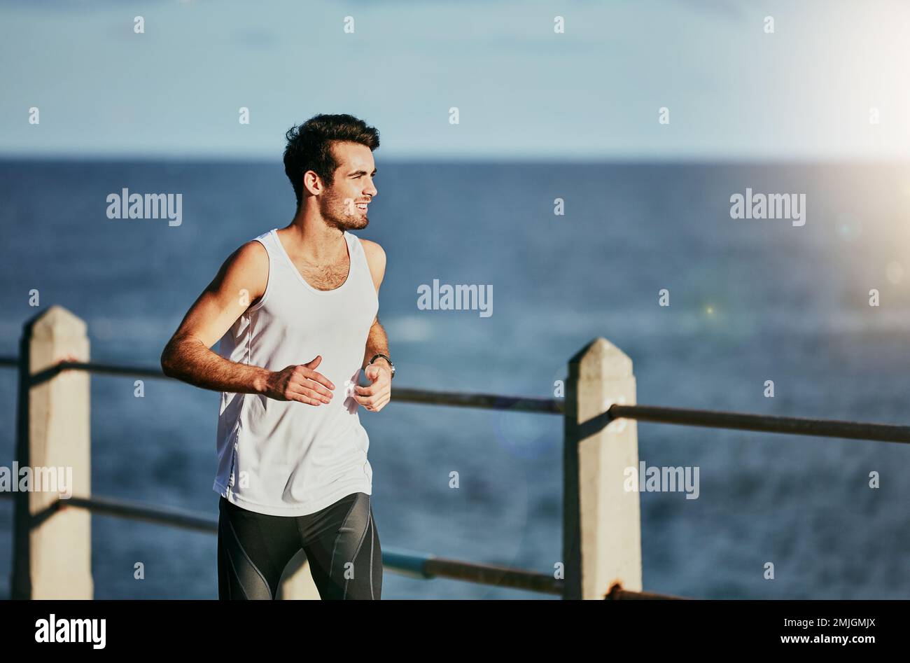 Running is my escape. a sporty young man out for a run Stock Photo - Alamy
