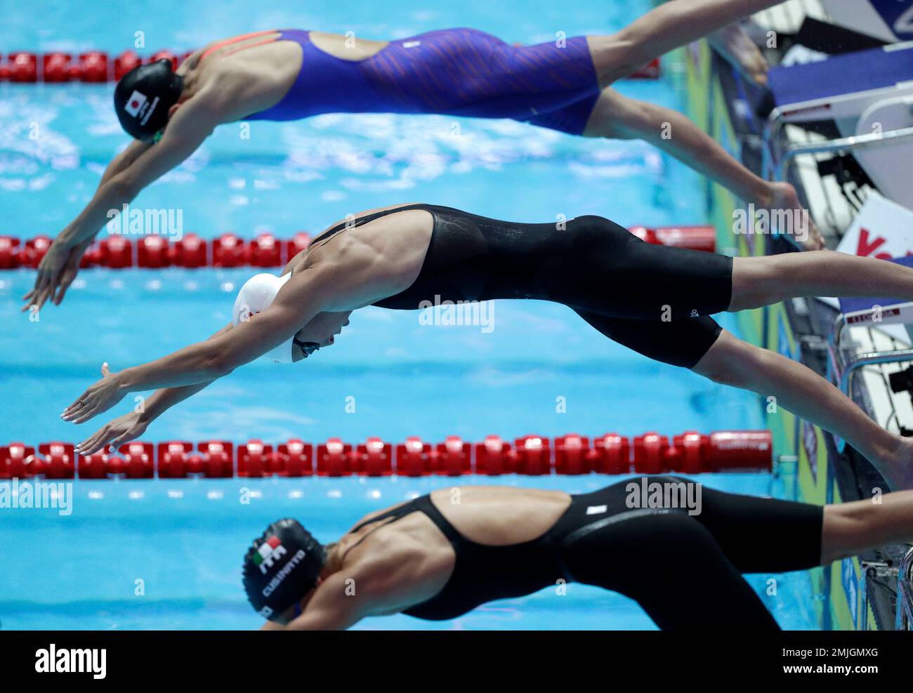 Canada's Sydney Pickrem, centre, starts in her heat of the women's 200m ...