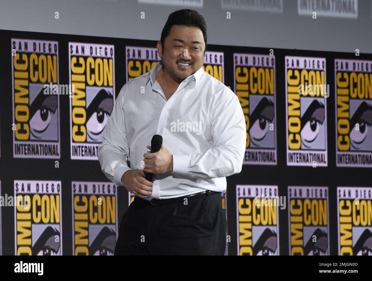 Don Lee walks on stage at the Marvel Studios panel on day three of ...