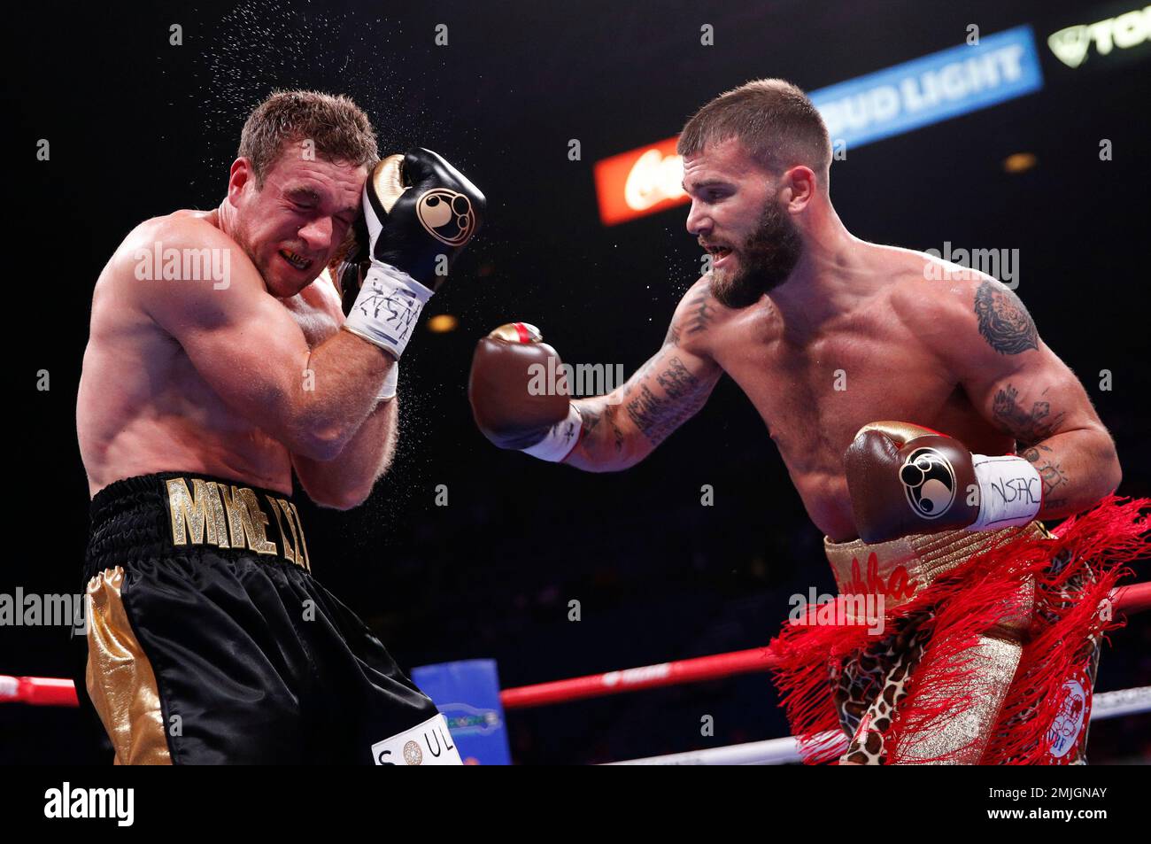 Caleb Plant, right, hits Mike Lee during a super middleweight title ...