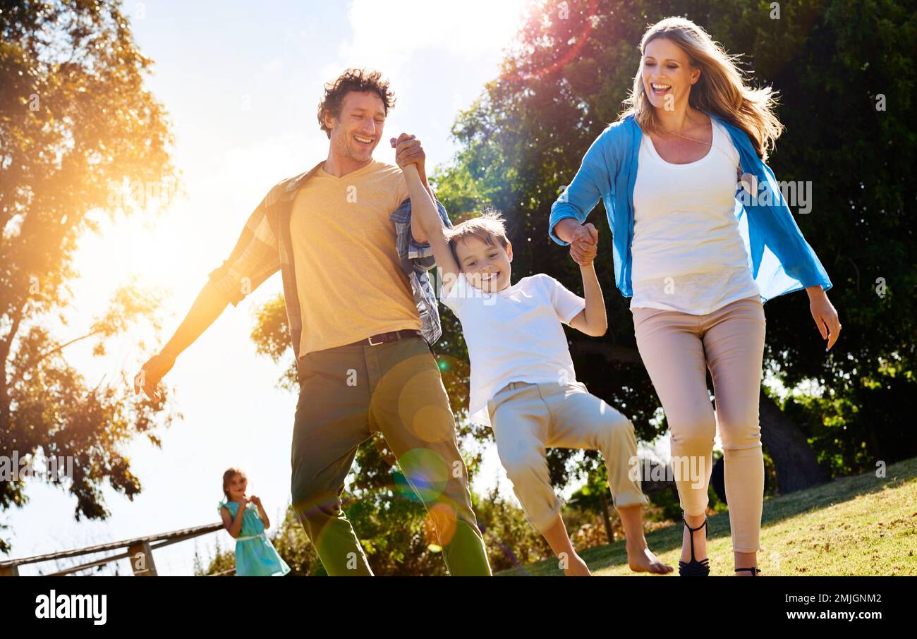 Family time is fun time. a happy family spending time together outdoors ...