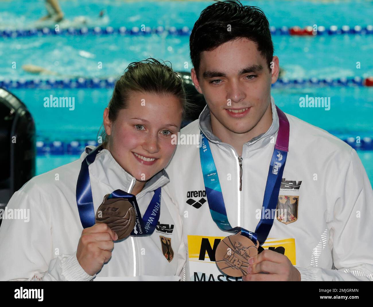 Bronze medalist Germany's Lou Massenberg and Tina Punzel stand with ...