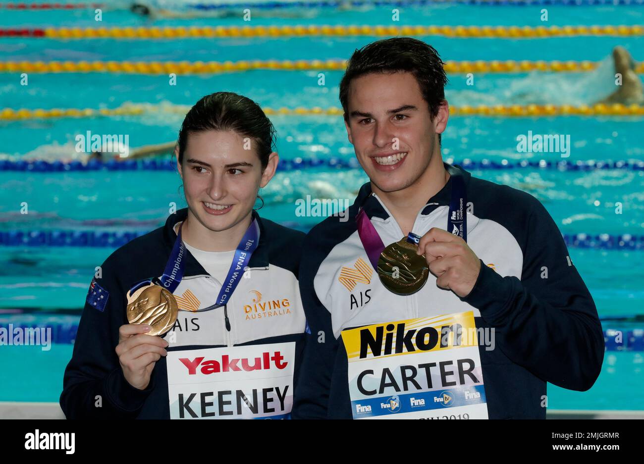 Gold medalist Australia's Maddison Keeney and Matthew Carter stand with ...
