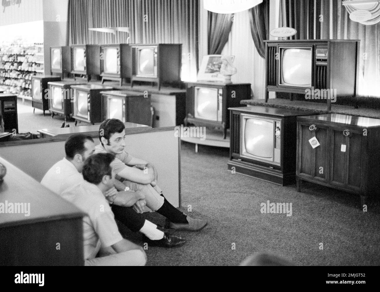 FILE - In this July 16, 1969 file photo, people watch the Apollo 11 ...