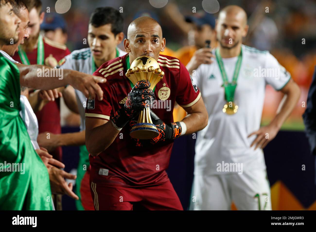 Algeria's goalkeeper Adi-Rais Mbolhi kisses the trophy after the ...